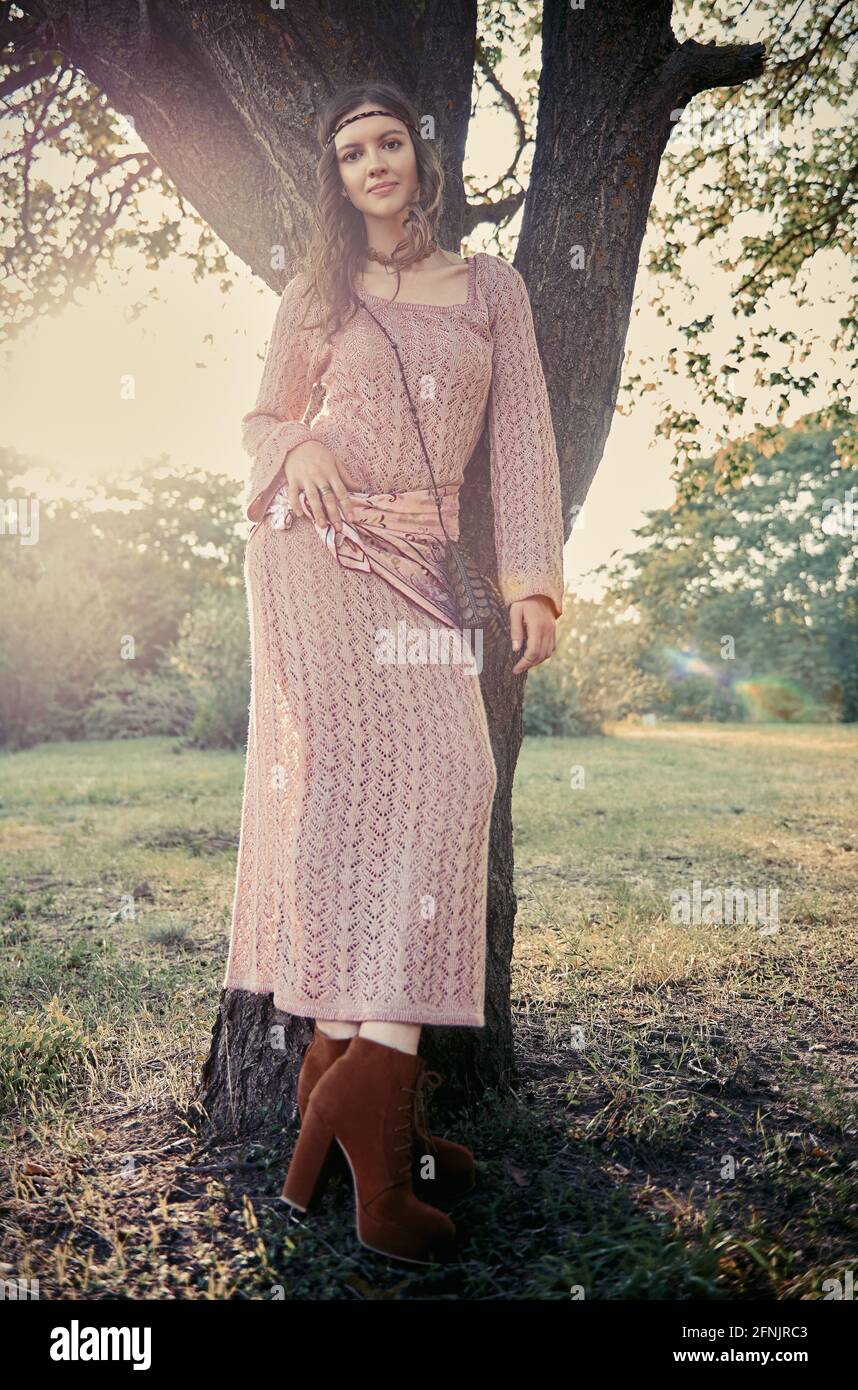 Outdoor portrait of the beautiful young boho (hippie) girl in grove ...