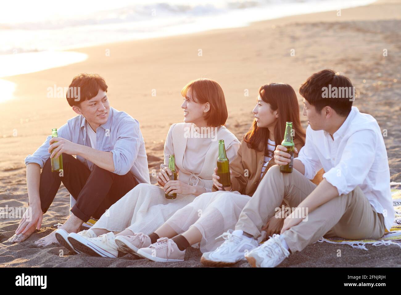 Young Japanese friends at the beach Stock Photo - Alamy