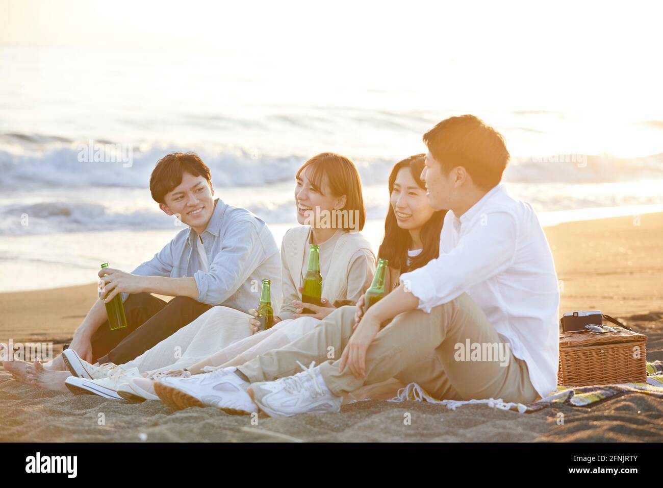 Young Japanese friends at the beach Stock Photo - Alamy