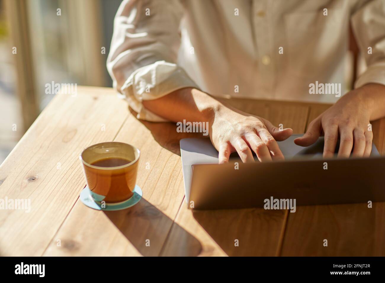 Young Japanese man at a cafe Stock Photo - Alamy