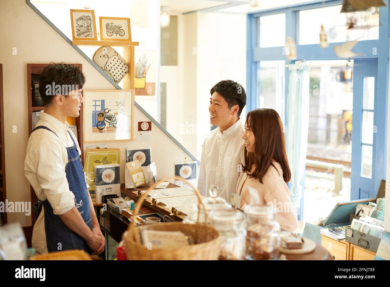 Young Japanese couple at a cafe Stock Photo - Alamy