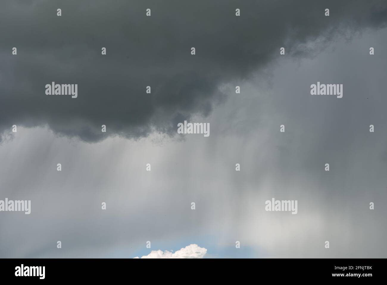 Thunder Storm sky grey dark clouds with rain pouring through clouds ...
