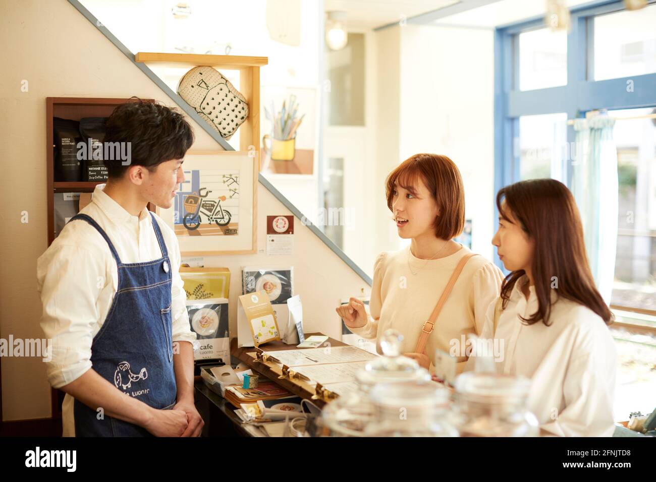 Young Japanese friends at a cafe Stock Photo - Alamy