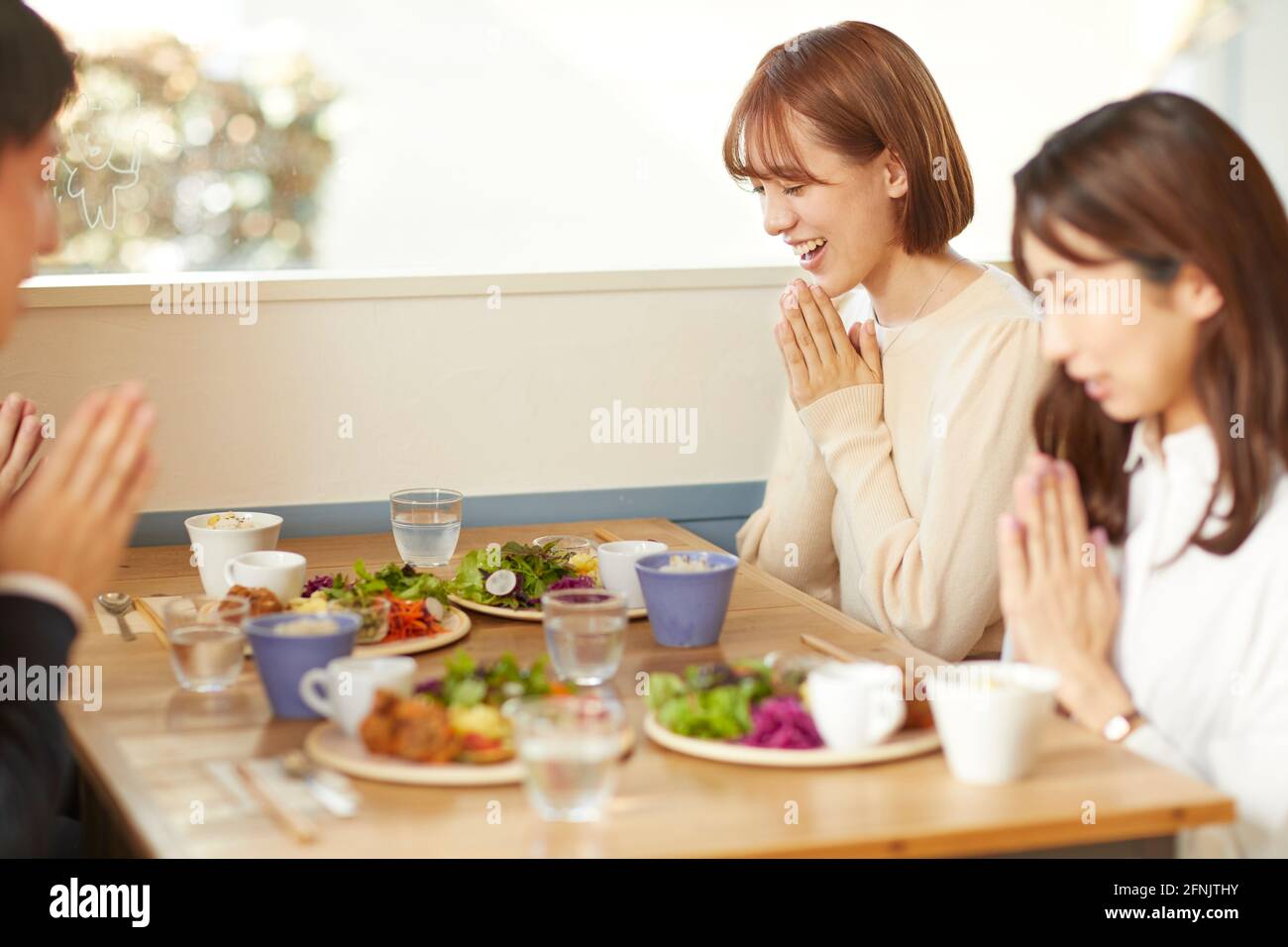 Young Japanese friends at a cafe Stock Photo - Alamy