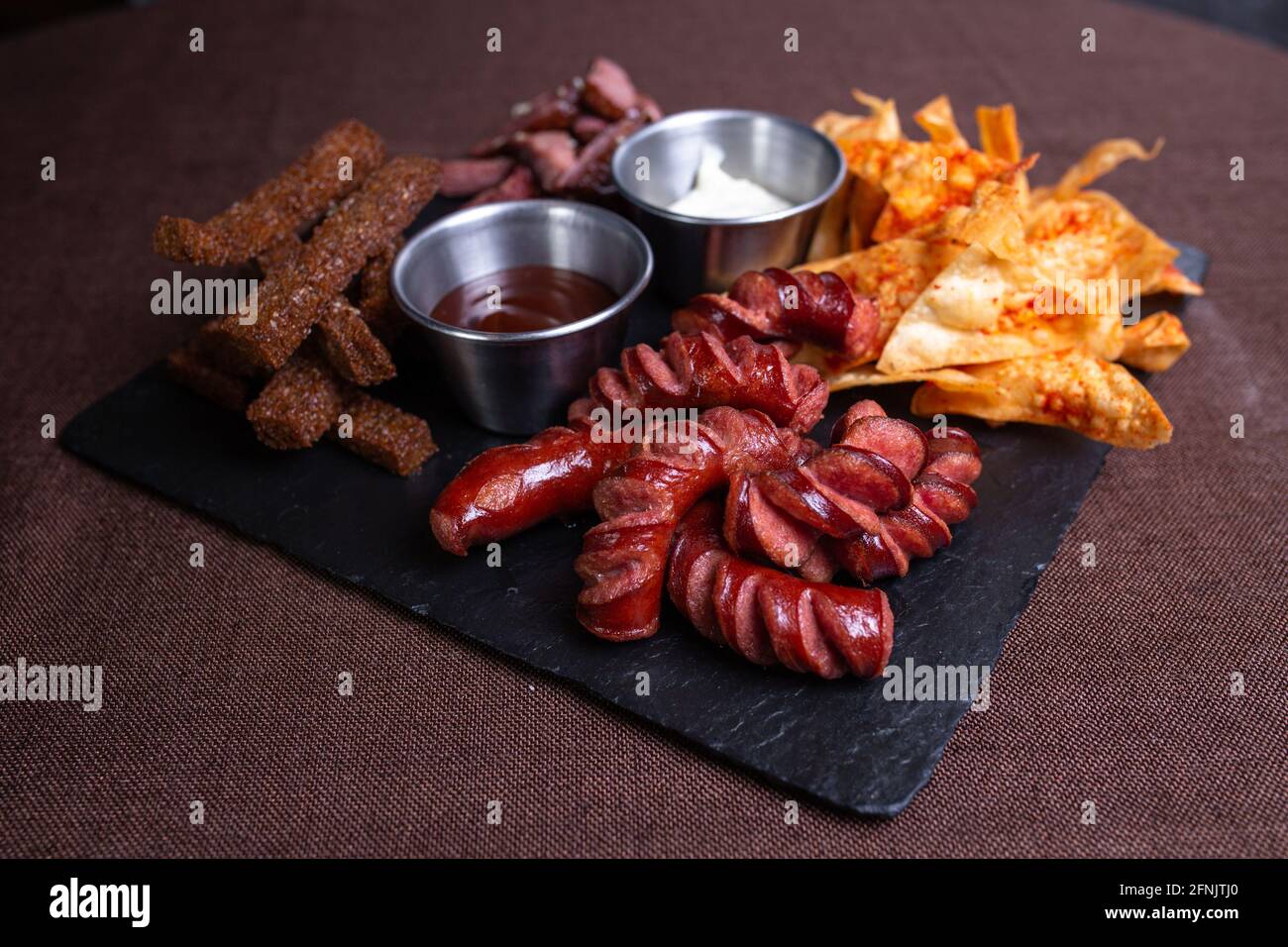 set snack to beer from sausages, crackers, chips and smoked meat Stock ...