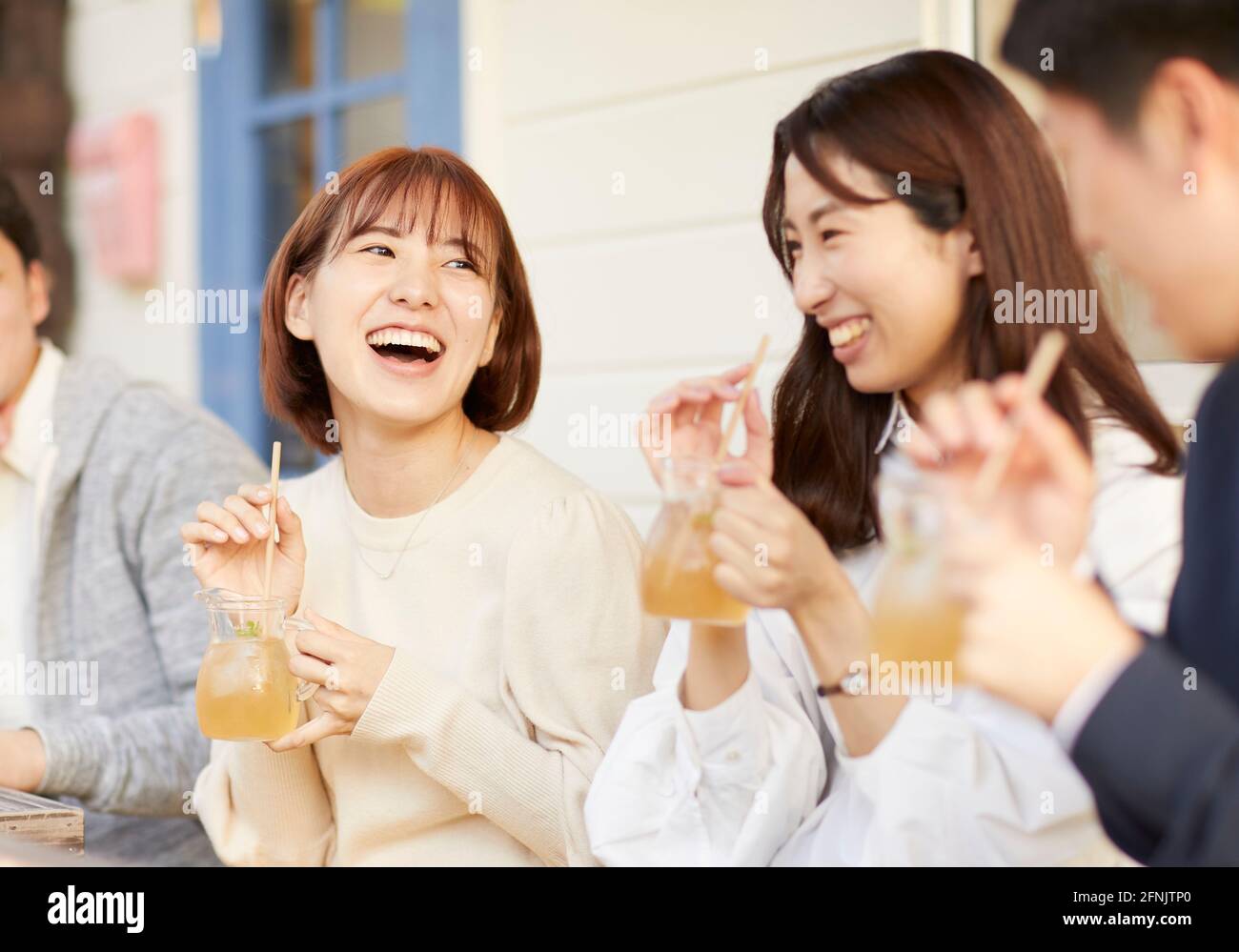 Young Japanese friends at a cafe Stock Photo - Alamy