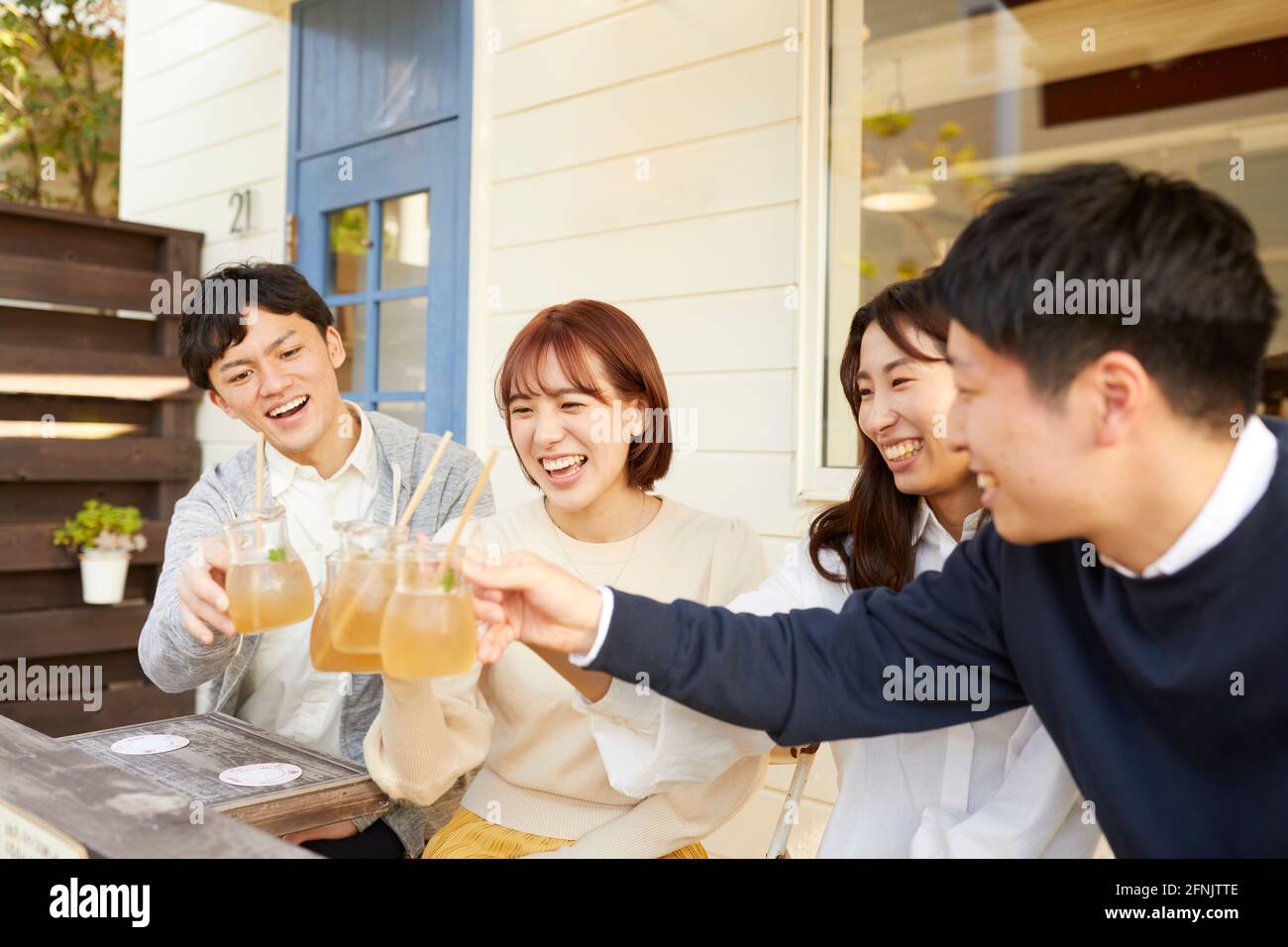 Young Japanese friends at a cafe Stock Photo - Alamy