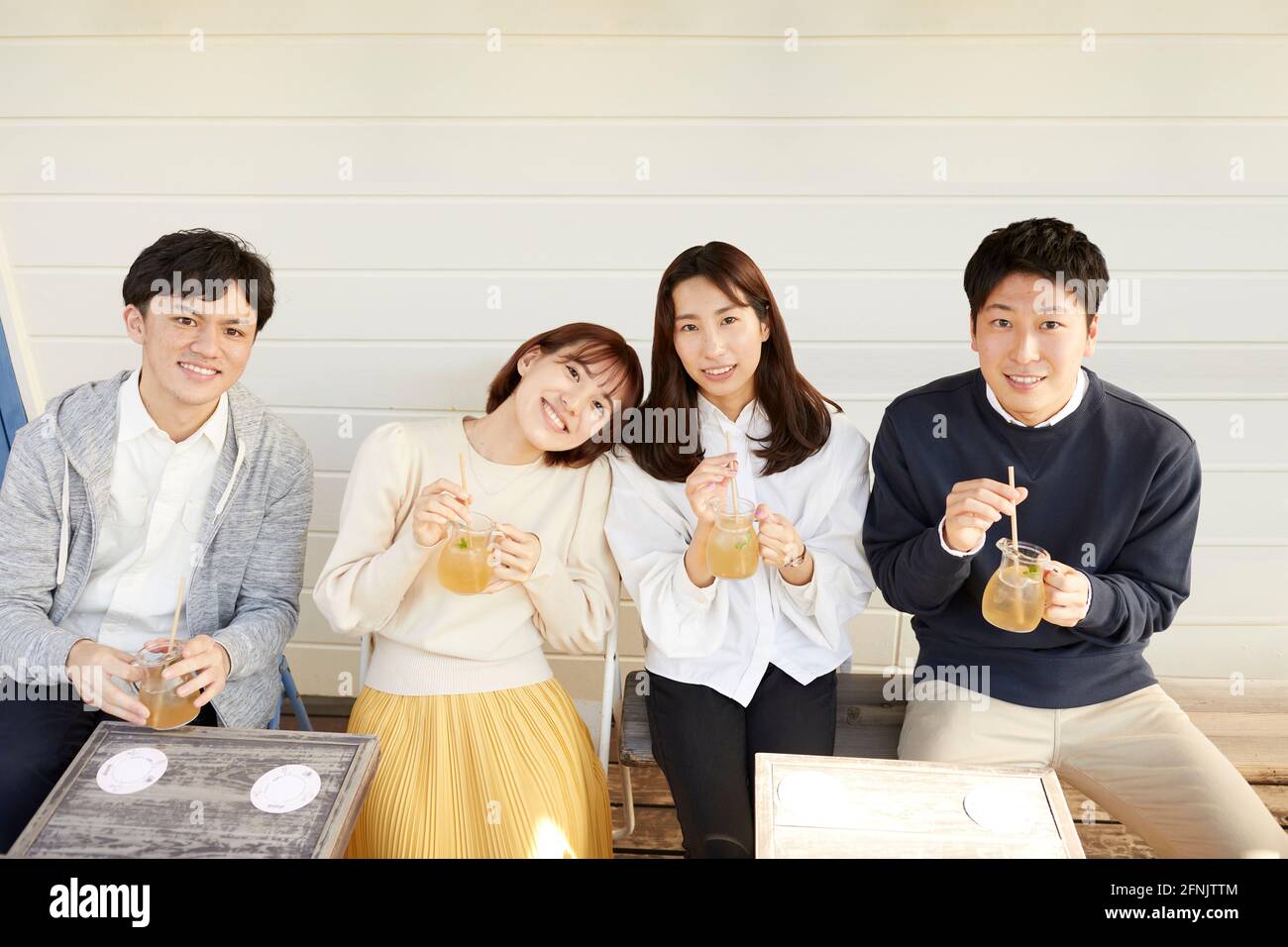Young Japanese friends at a cafe Stock Photo - Alamy