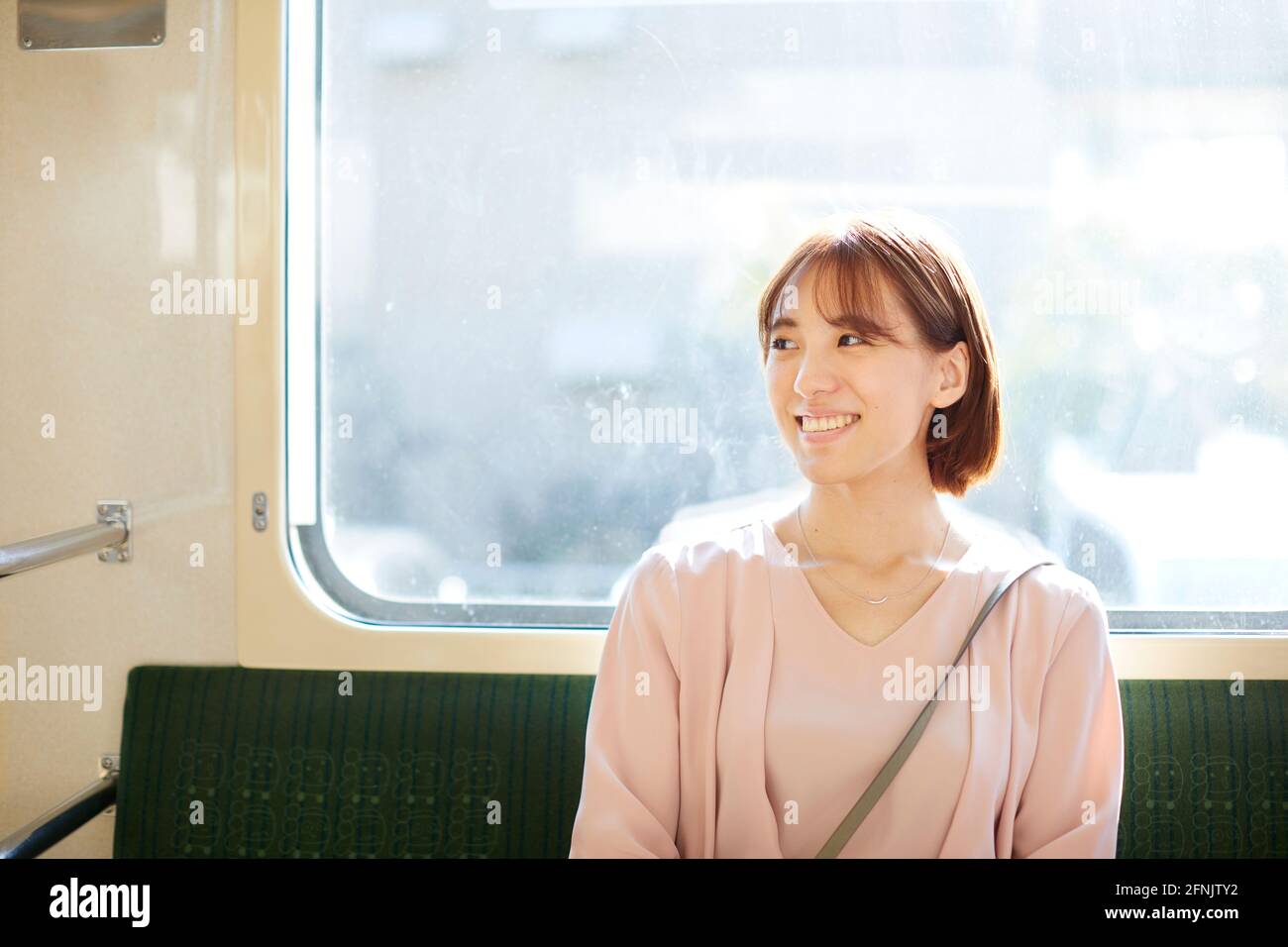 Young Japanese woman on a train Stock Photo - Alamy