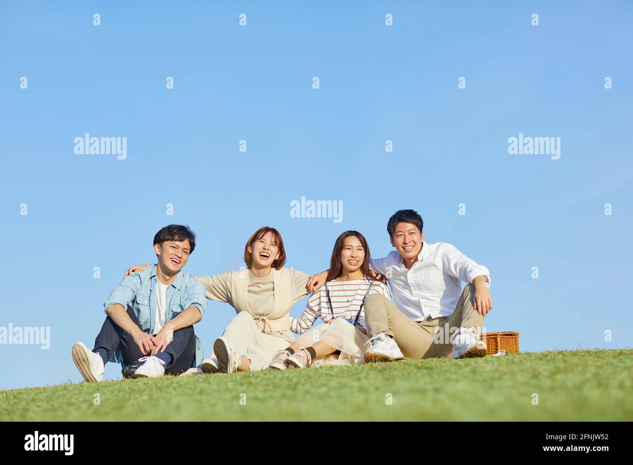 Young Japanese friends at a city park Stock Photo - Alamy