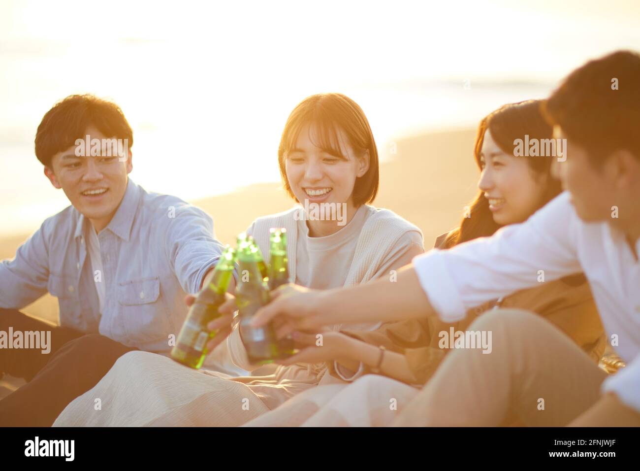 Young Japanese friends at the beach Stock Photo - Alamy