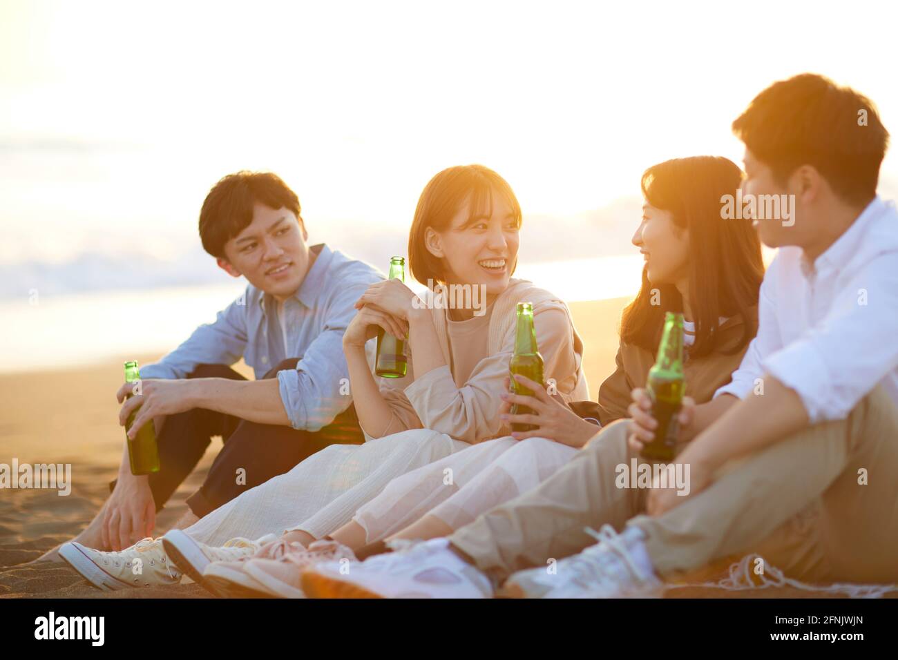 Young Japanese friends at the beach Stock Photo - Alamy