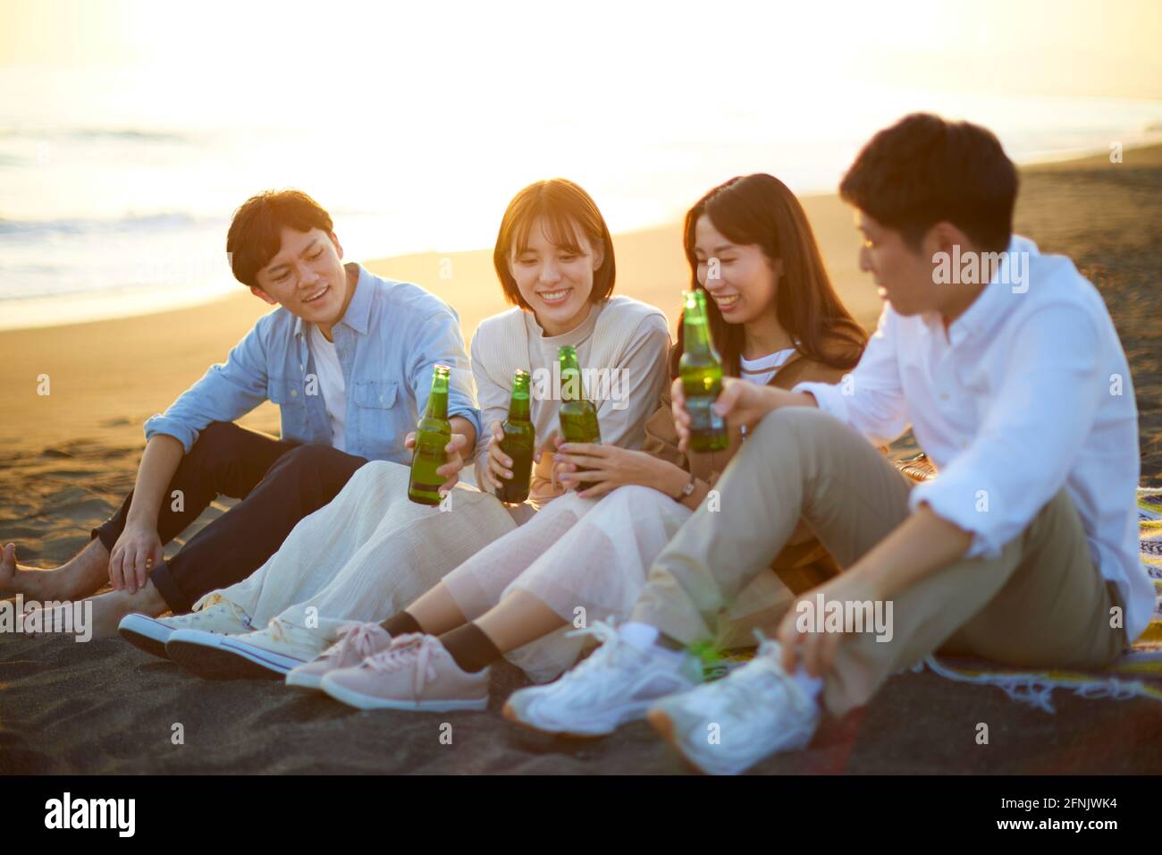 Young Japanese friends at the beach Stock Photo - Alamy