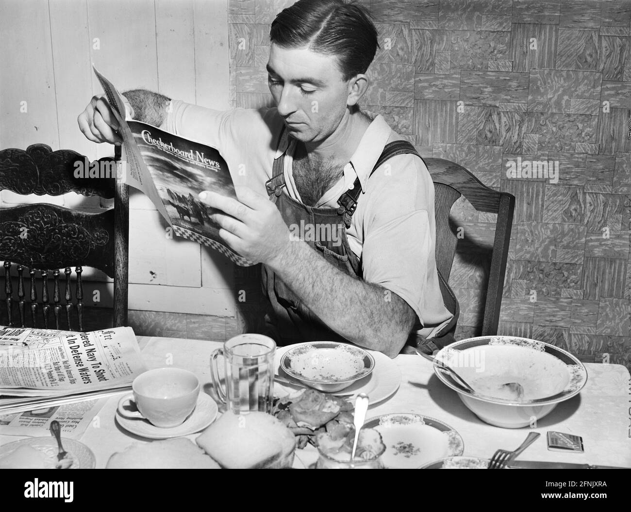 William Gaynor reading Farm Journal at Kitchen Table, Jack Delano, near ...