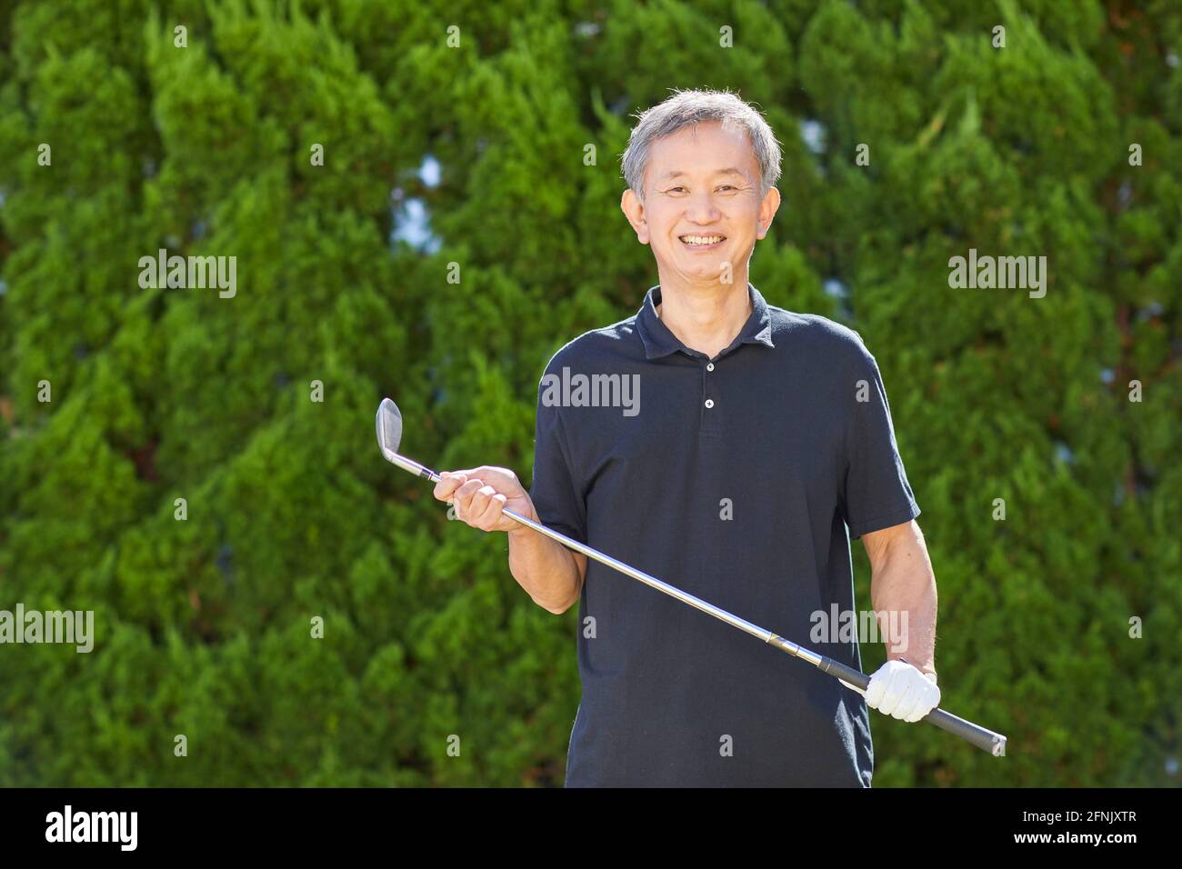 Asian man playing golf hi-res stock photography and images - Alamy