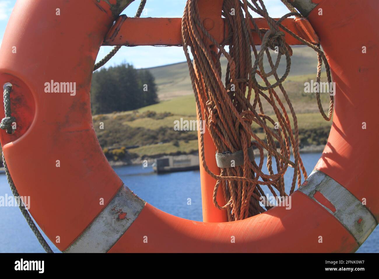 Sulby reservoir Isle of Man framed by a lifebuoy Stock Photo - Alamy