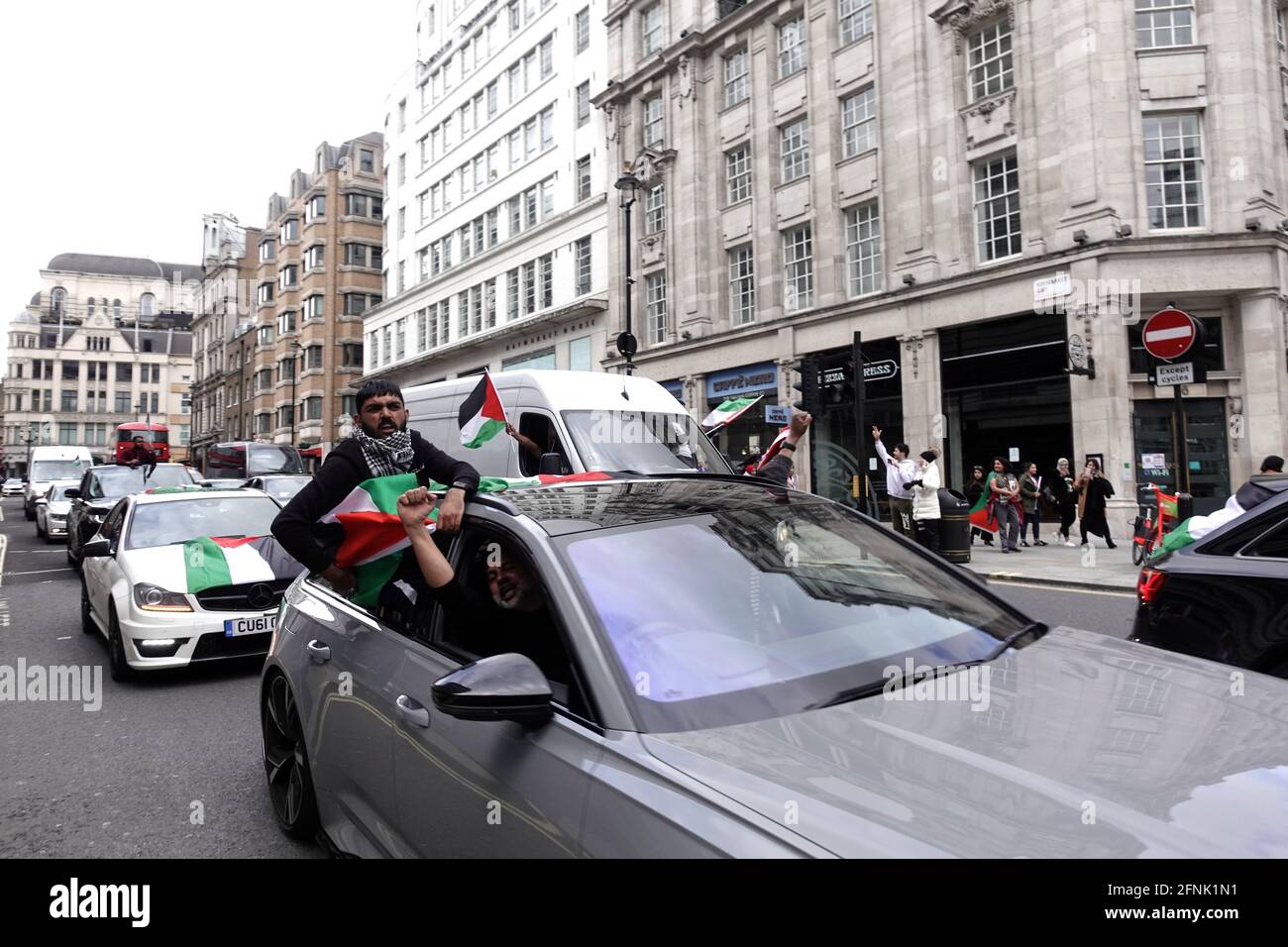 Pro Palestinian supporters drive through the streets of Central London ...
