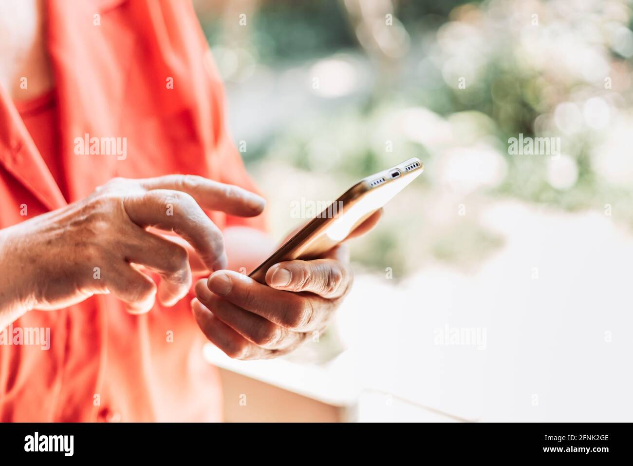 Elderly woman touching phone screen with her finger Stock Photo - Alamy