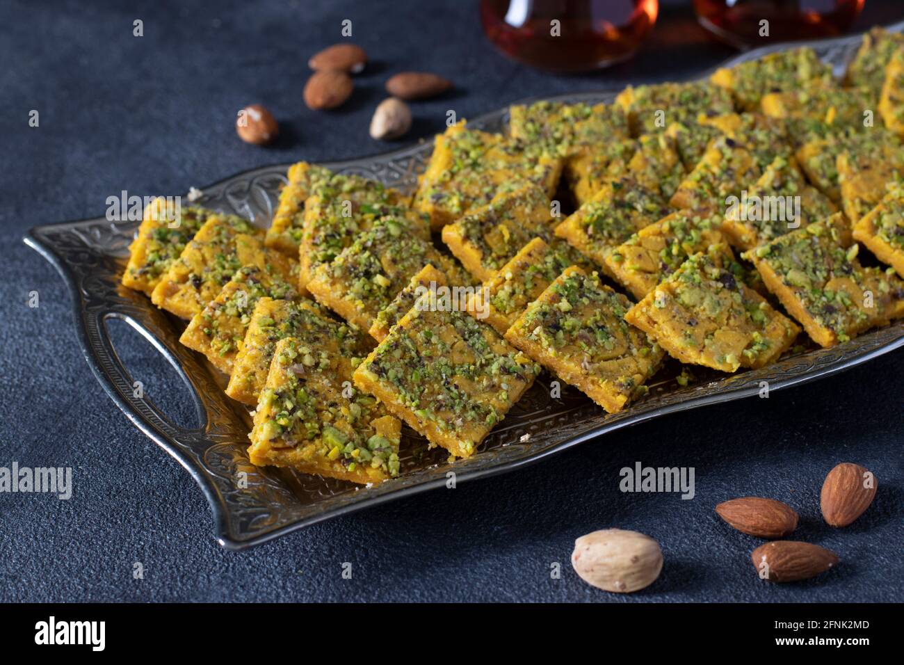 Traditional Persian dessert Sohan from Iran. Tea ceremony with sohan on ...