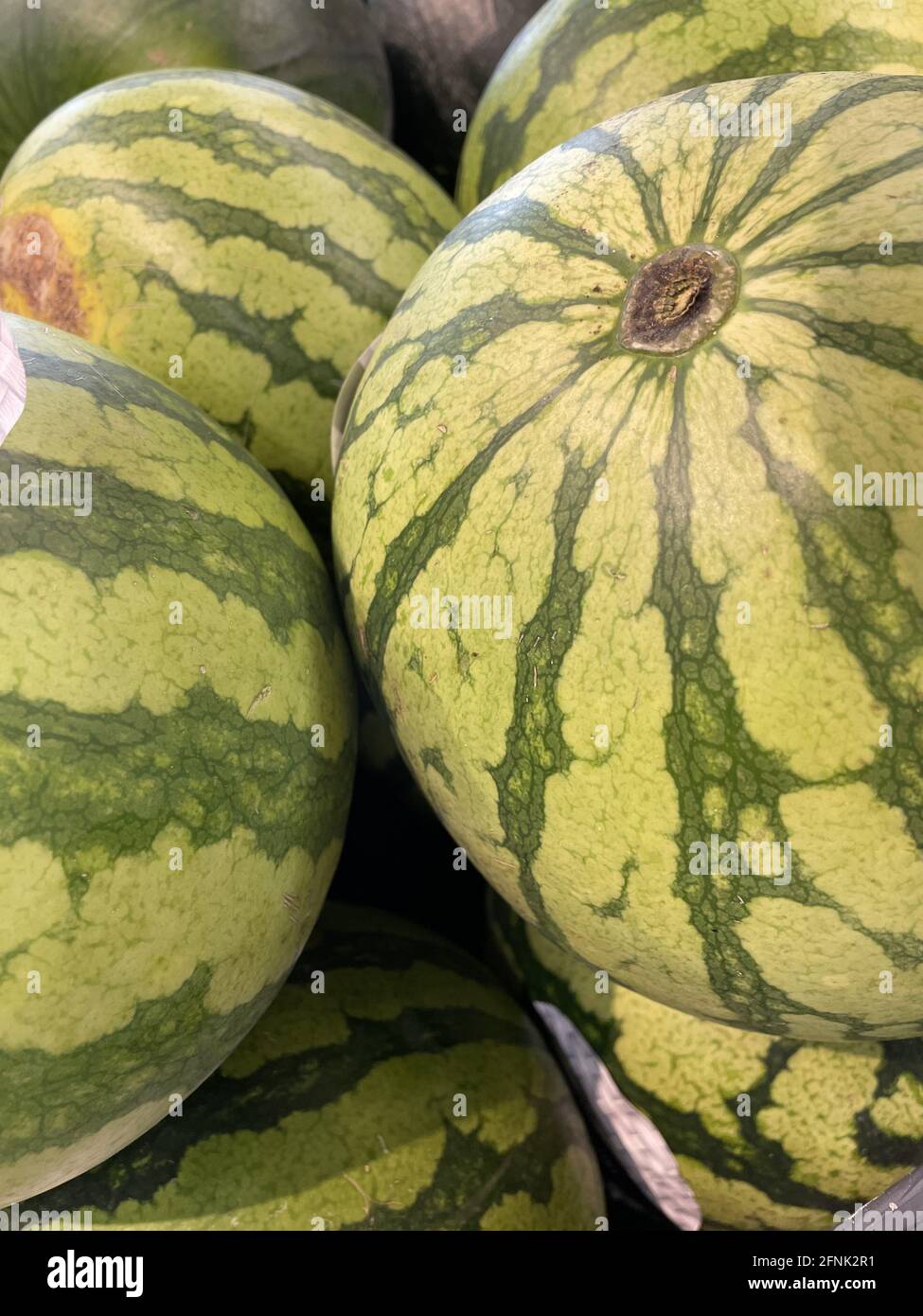 Vertical closeup shot of fat watermelons in a heap in the store Stock ...