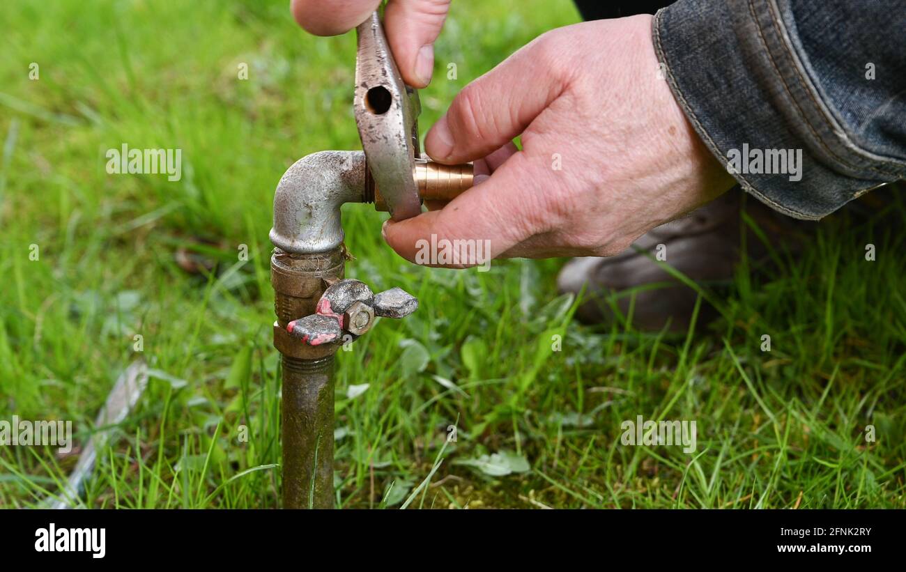 Repairing the street water pipe Stock Photo - Alamy