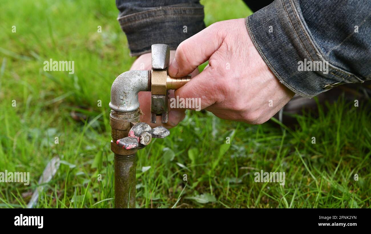 Repairing the street water pipe Stock Photo - Alamy