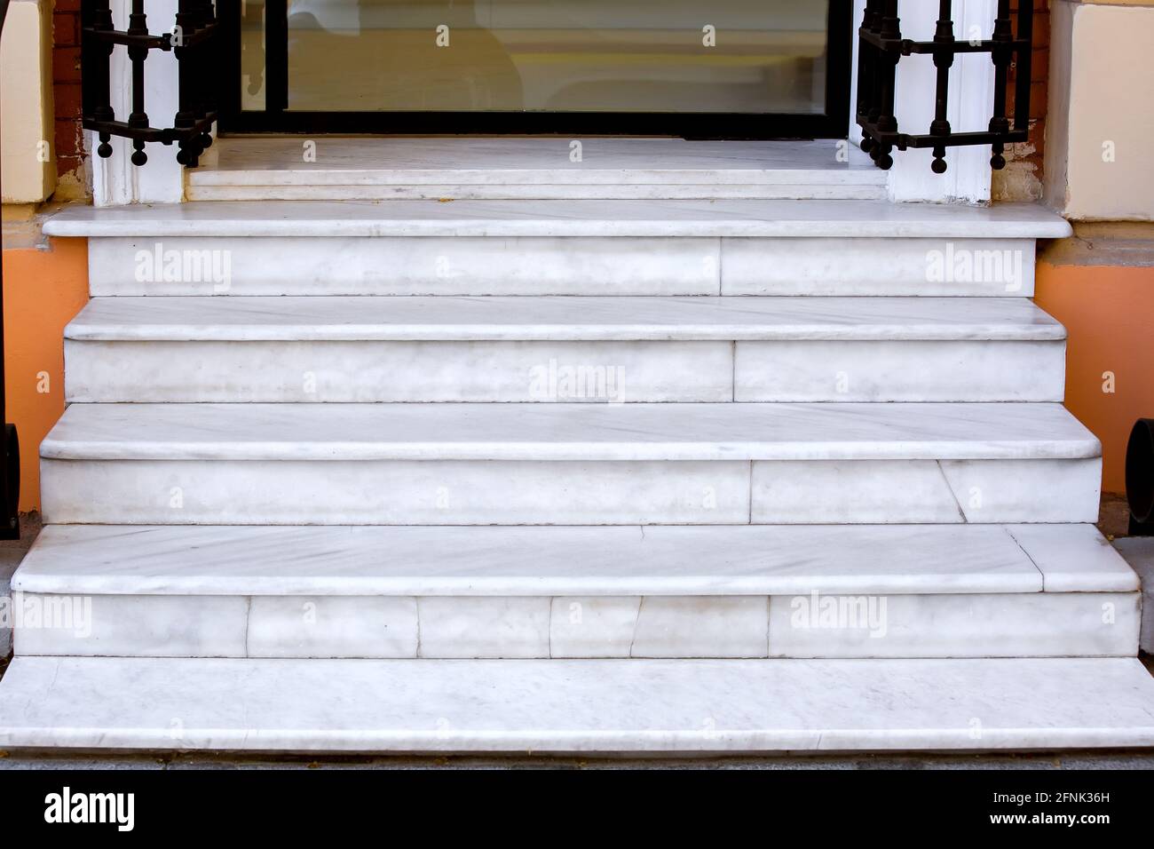 white marble staircase with stone steps at the threshold of the store ...