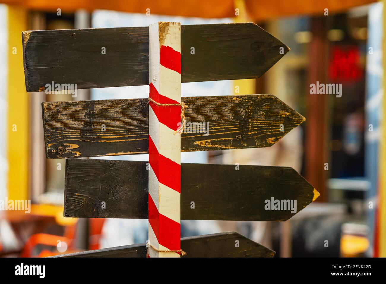 Vintage wooden road sign pointing for different directions Stock Photo ...