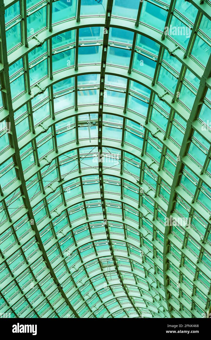 Curved glass roof, Ceiling with steel arch close-up. Openwork glazing ...