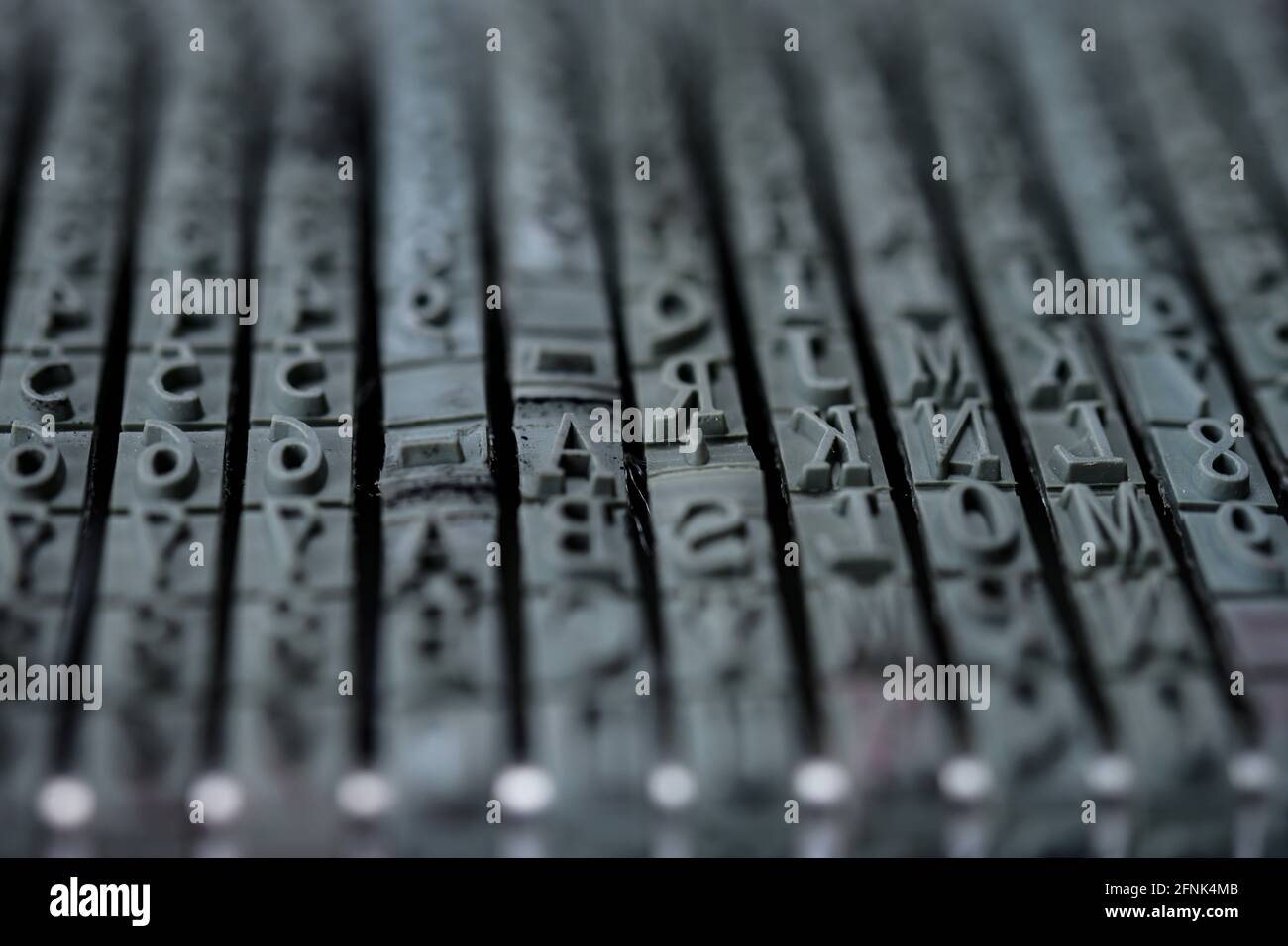 Rolling rubber stamp letters and numbers macro shot Stock Photo - Alamy