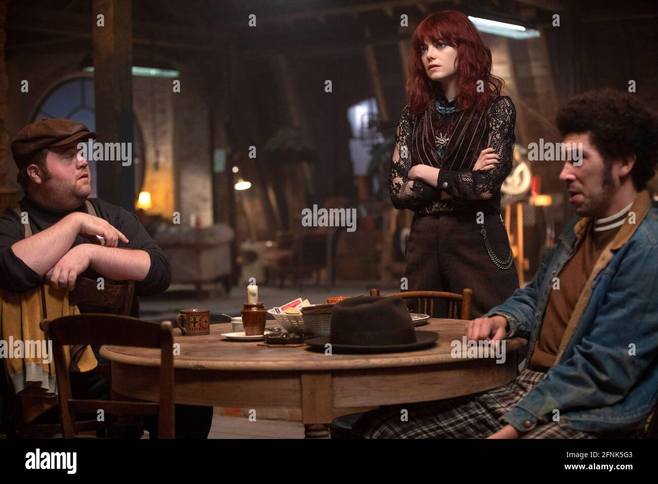 CRUELLA, from left: Paul Walter Hauser, Emma Stone, Joel Fry, 2021. ph ...