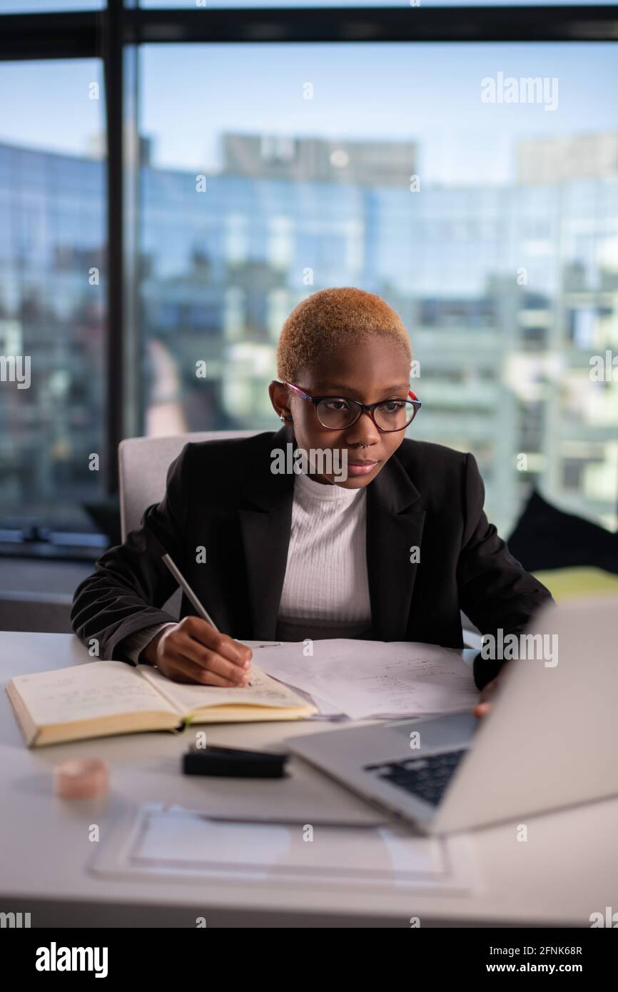 Smart African American manager working on project Stock Photo - Alamy
