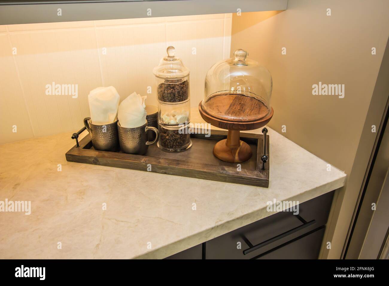 Wooden Tray Of Decorator Items On Kitchen Counter Top Stock Photo - Alamy