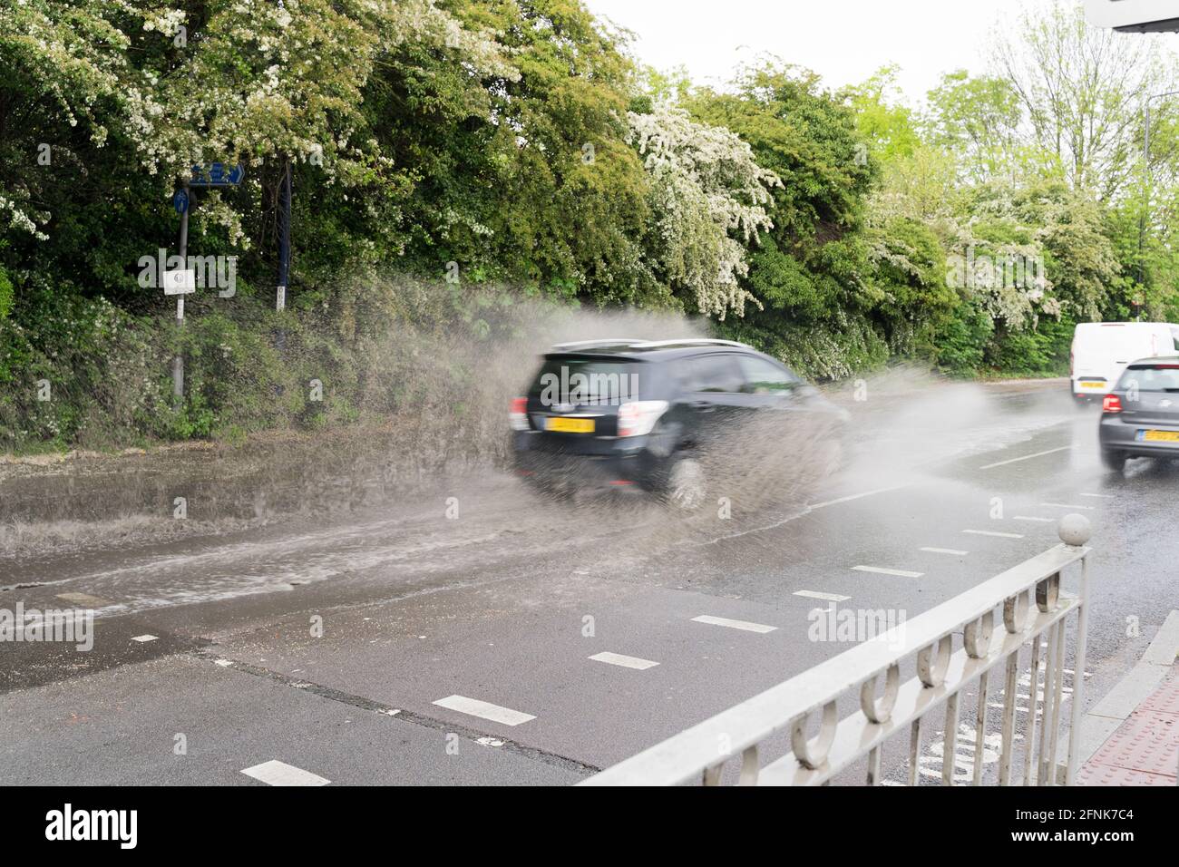 Splash from flash flood on south circular road, greater London, England ...