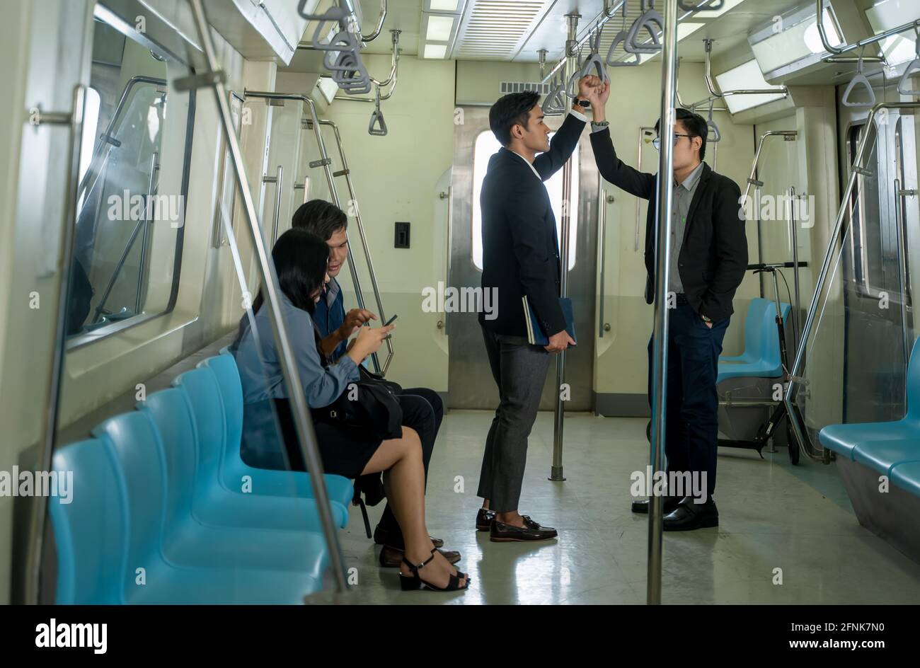 Business checking mobile train hi-res stock photography and images - Alamy