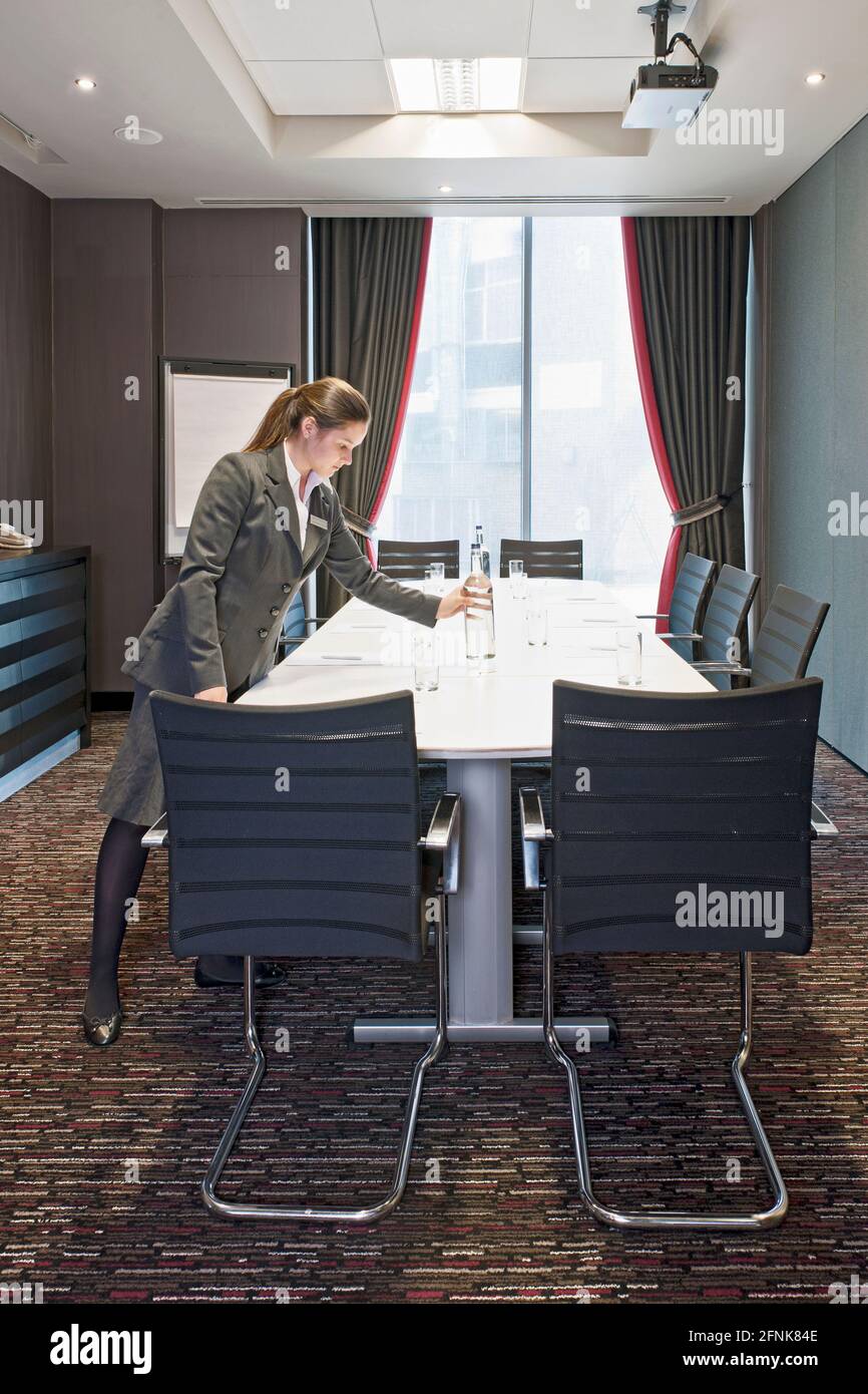 waiter preparing meeting room at hotel in England Stock Photo - Alamy