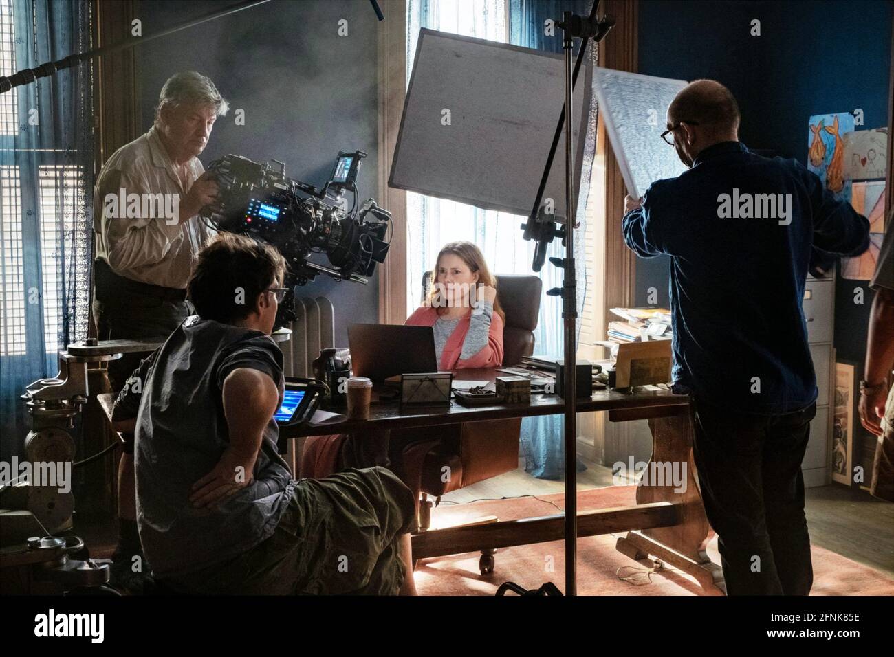 THE WOMAN IN THE WINDOW, camera operator Craig Haagensen (left), director Joe Wright (front left ...