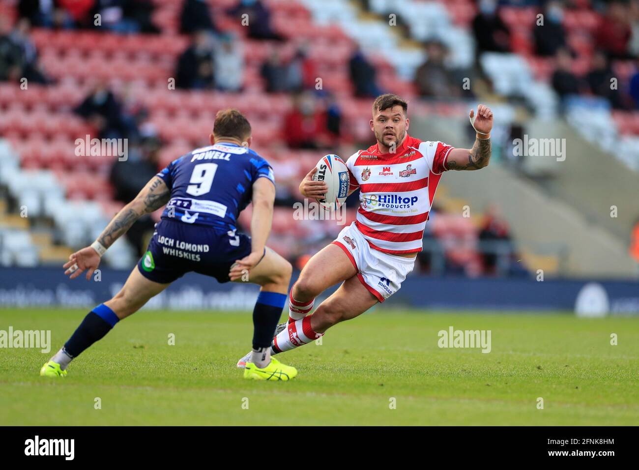Liam Hood #9 of Leigh Centurions tries to get past Sam Powell #9 of ...