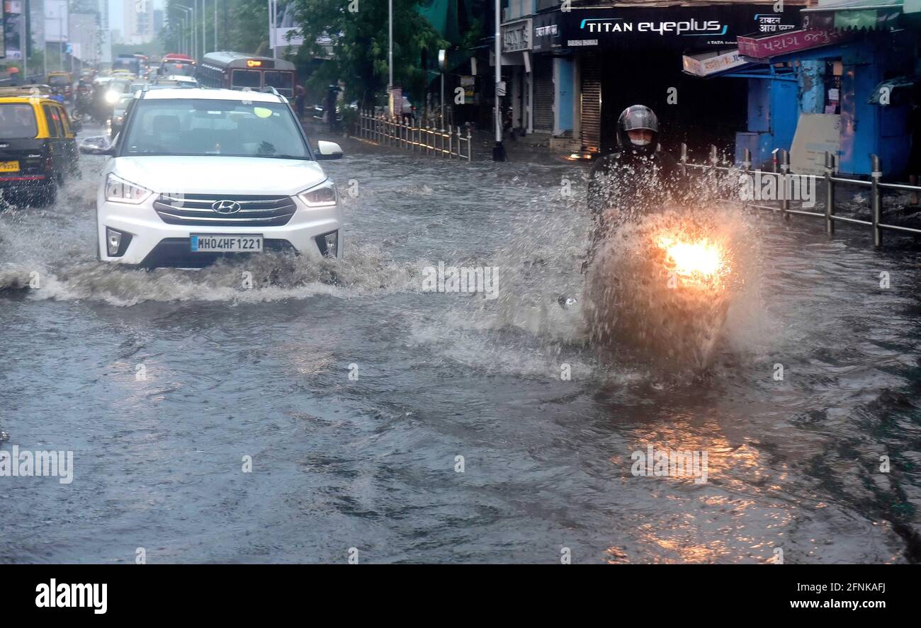 MUMBAI, INDIA - MAY 17: People deal with the water clogging in the wake ...