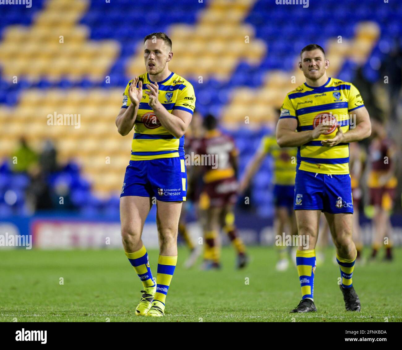 Ben Currie (11) of Warrington Wolves and Rob Mulhern (19) of Warrington ...