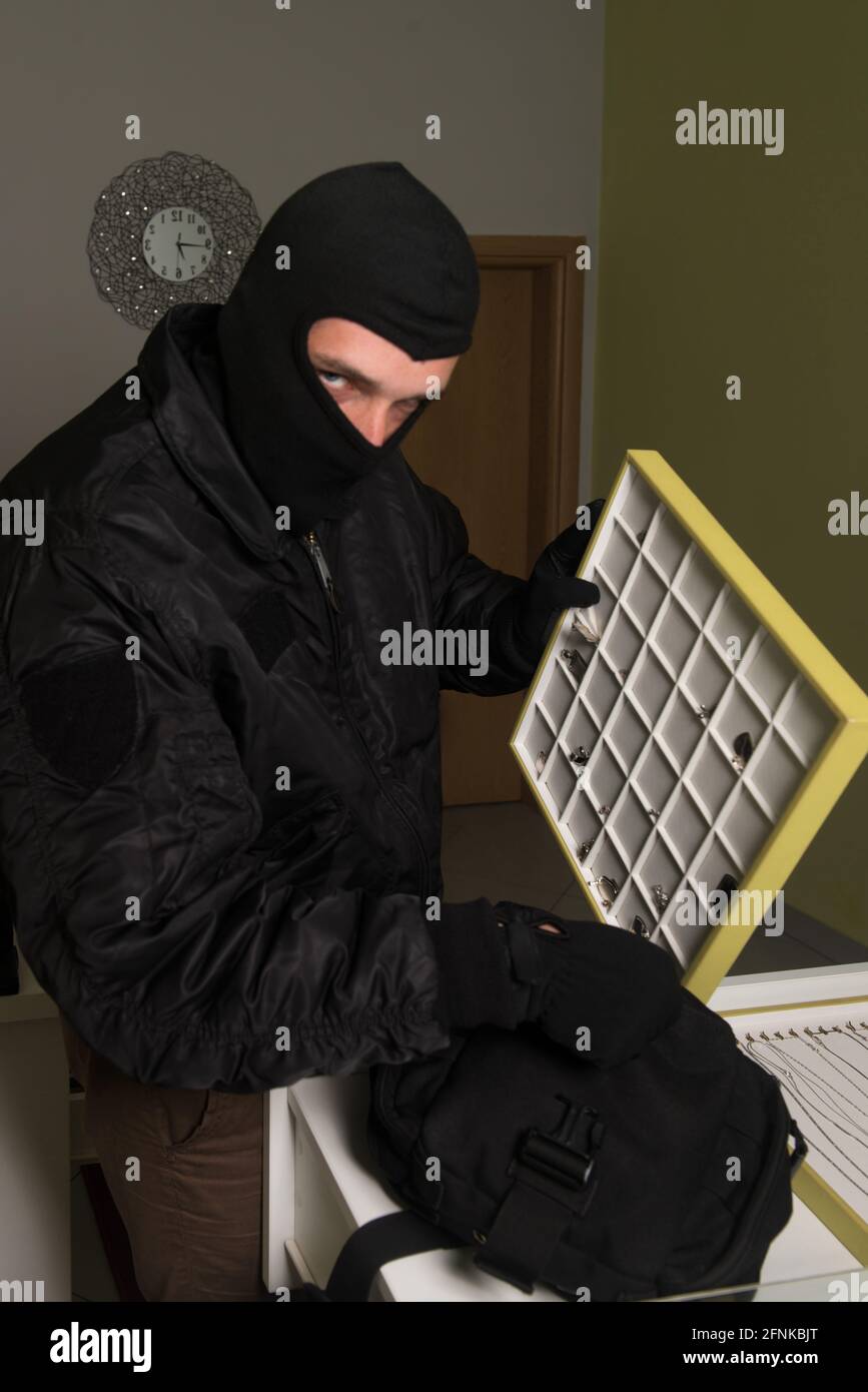 Armed robber jewelry hi-res stock photography and images - Alamy