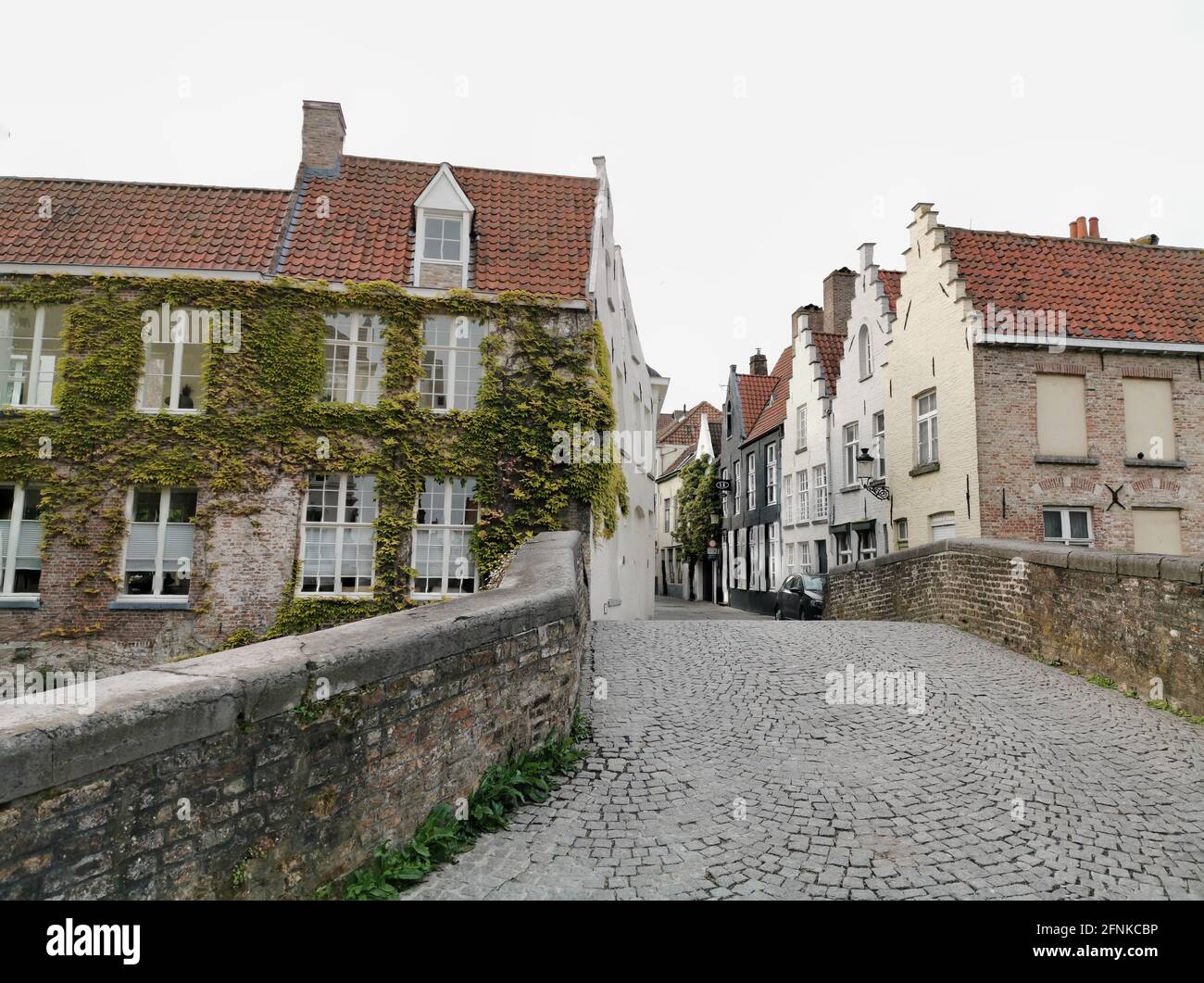 Classic view of a cobbled bridge leading into a side street surrounded ...