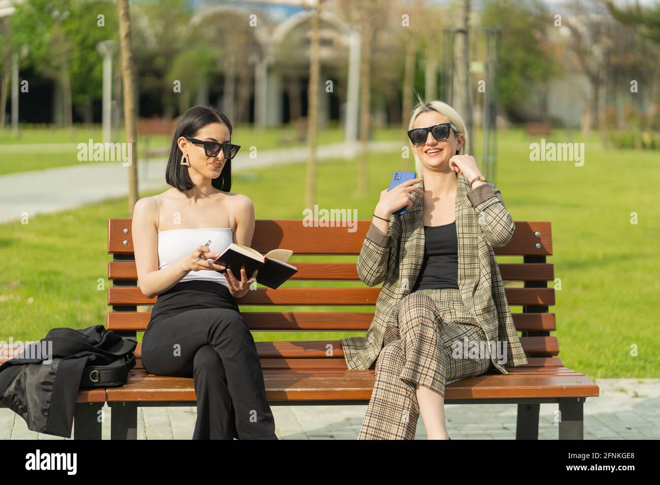 Serious woman talking note book hi-res stock photography and images - Alamy