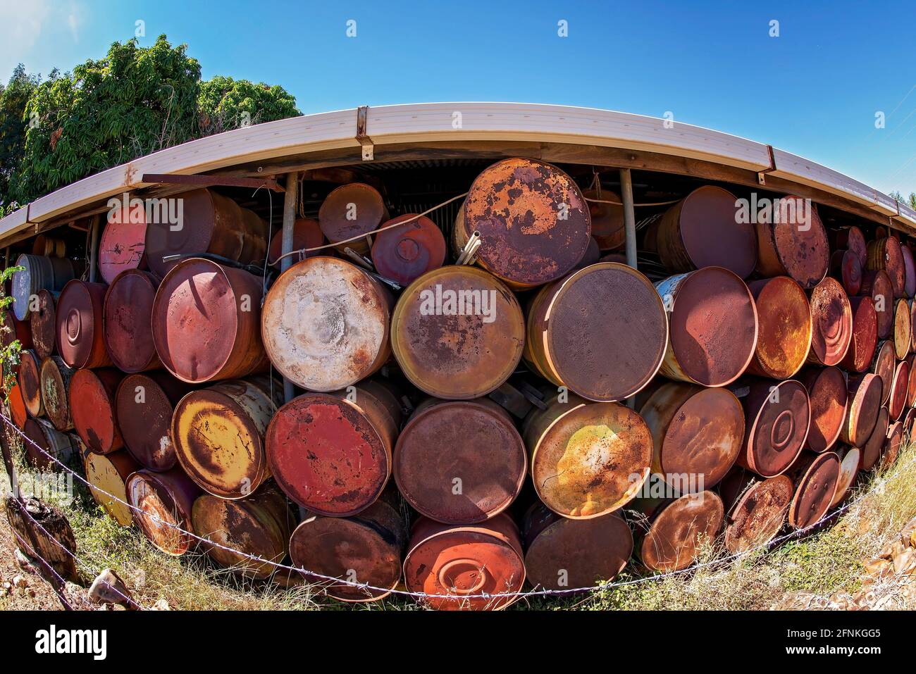 A wall made from rusted drums photographed with a fisheye lens Stock ...