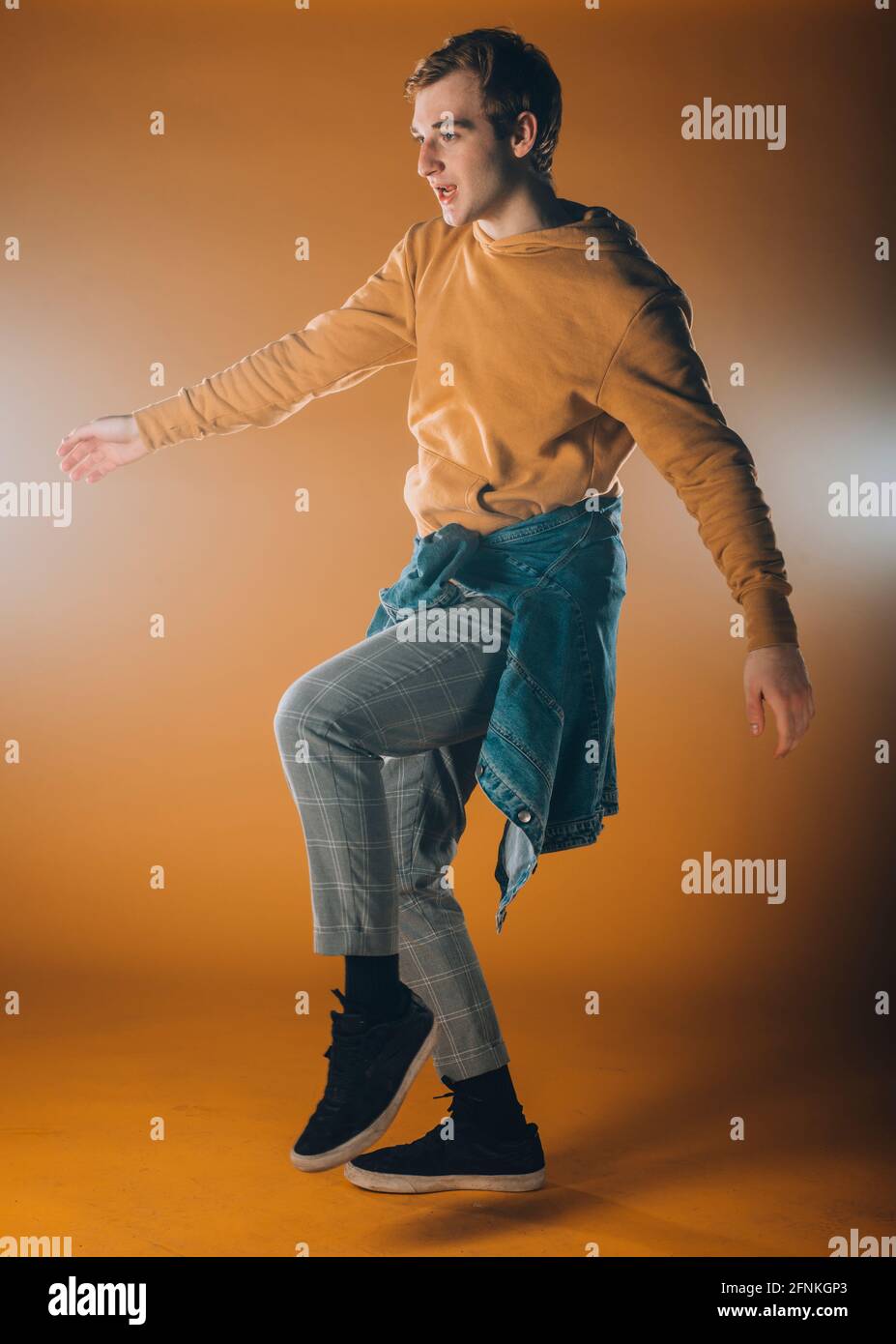 Dance moves performed by an acrobatic flexible male dancer Stock Photo ...