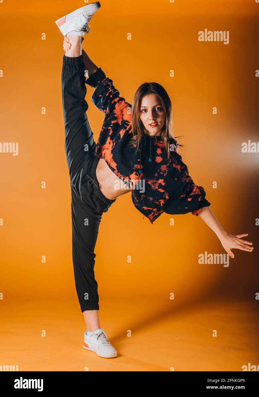 Dance moves performed by an acrobatic flexible female dancer Stock ...