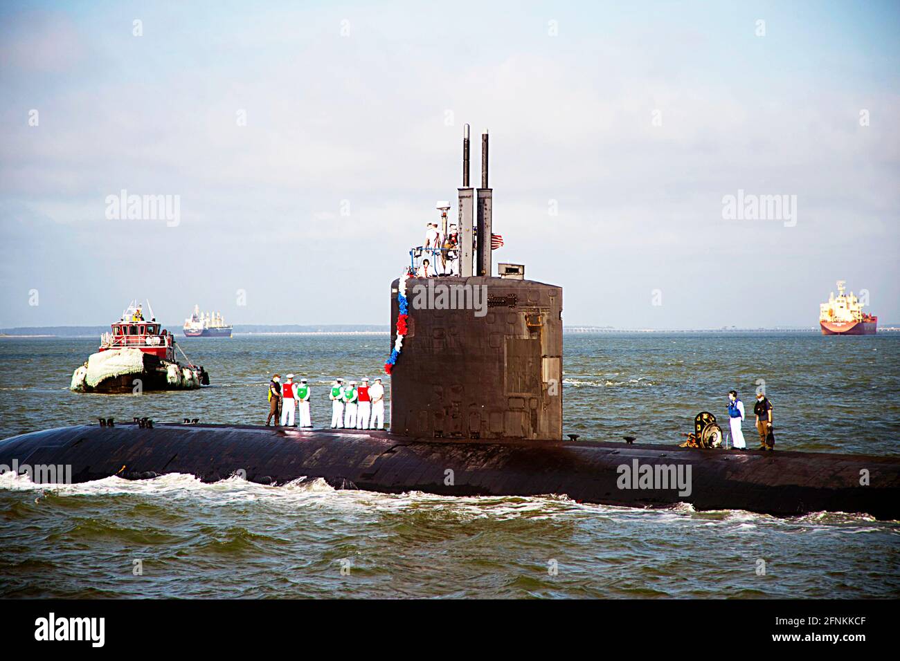 Sailors aboard the Los Angeles-class fast attack submarine USS Albany ...