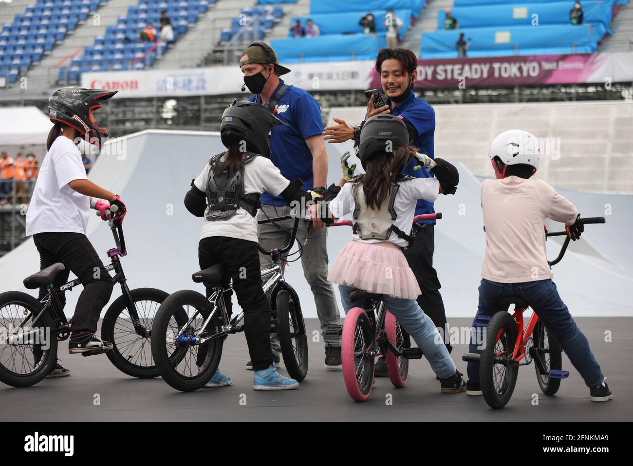 Riders receive guidance from 'Ready Steady Tokyo' test event staff ...