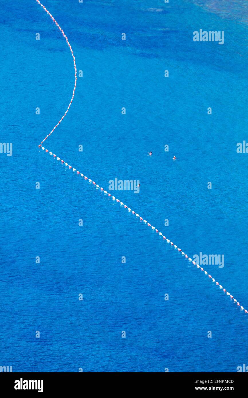 Aerial view of beach swimming area . Blue sea water view from above ...