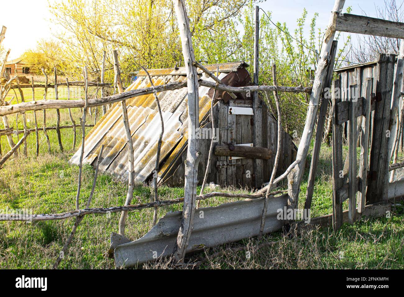 Old hut. A collapsed house with an old fence. Abandoned house Stock ...